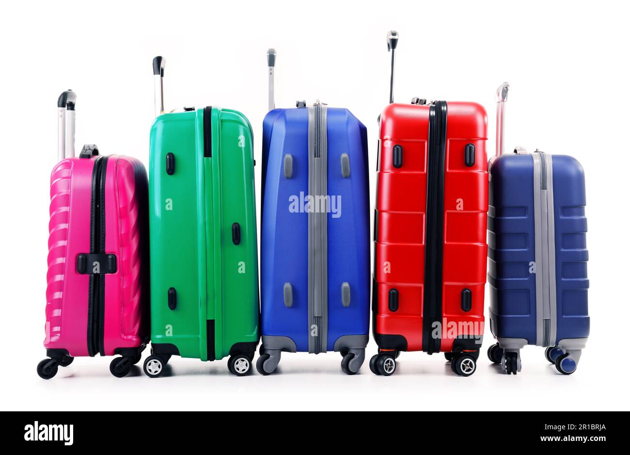 Five plastic suitcases isolated on white Stock Photo - Alamy