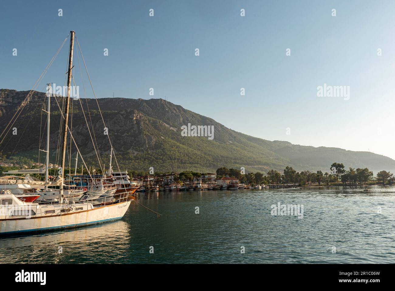 Boats are moored at the beautiful harbour of Turkish Riviera seaside ...