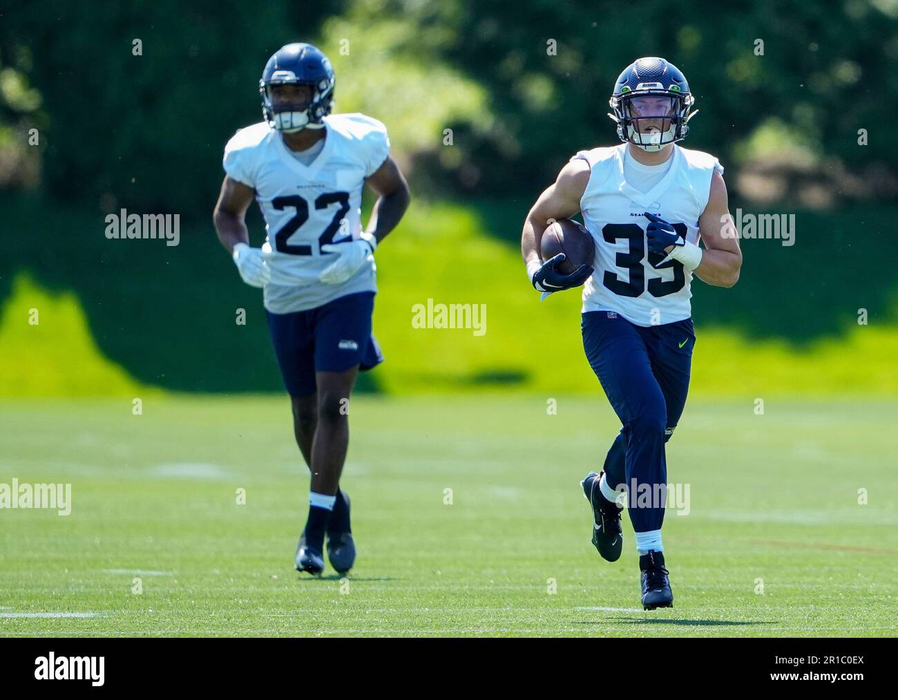 Seattle Seahawks safety Kenderick Duncan (22) and safety Ty Okada (39 ...