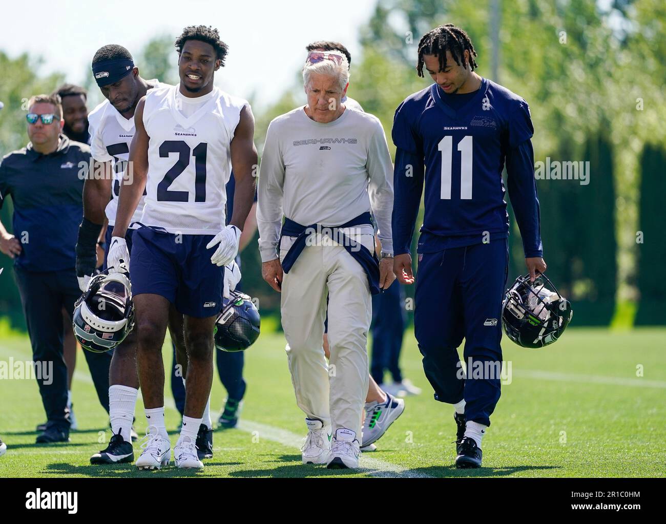 Seattle Seahawks linebacker Derick Hall, back left, cornerback Devon ...