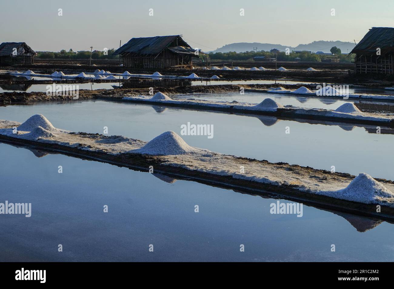 The process of crystallization of sea water into salt in the ...