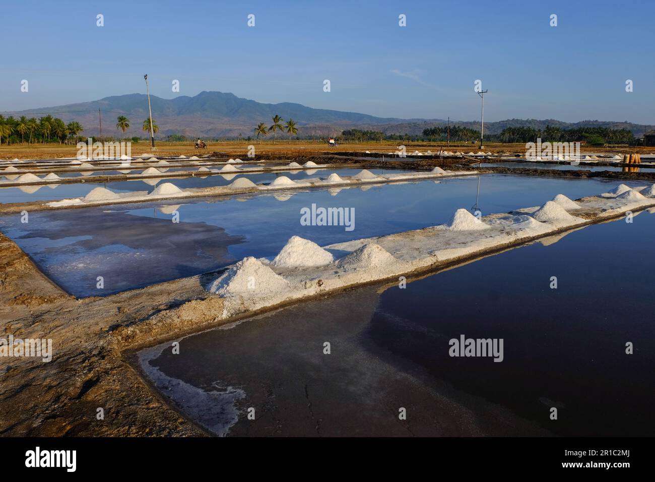 The process of crystallization of sea water into salt in the ...
