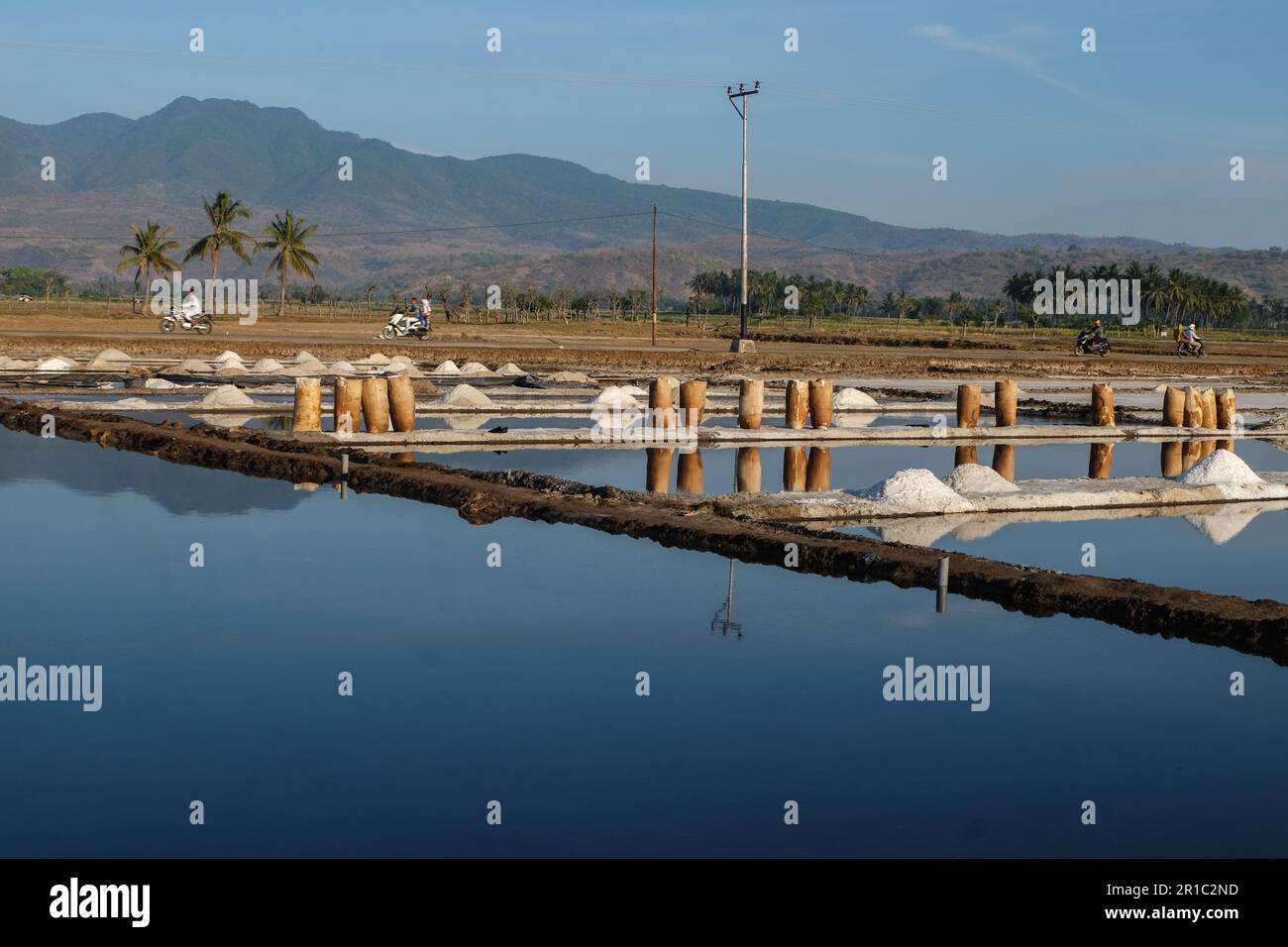 The process of crystallization of sea water into salt in the ...