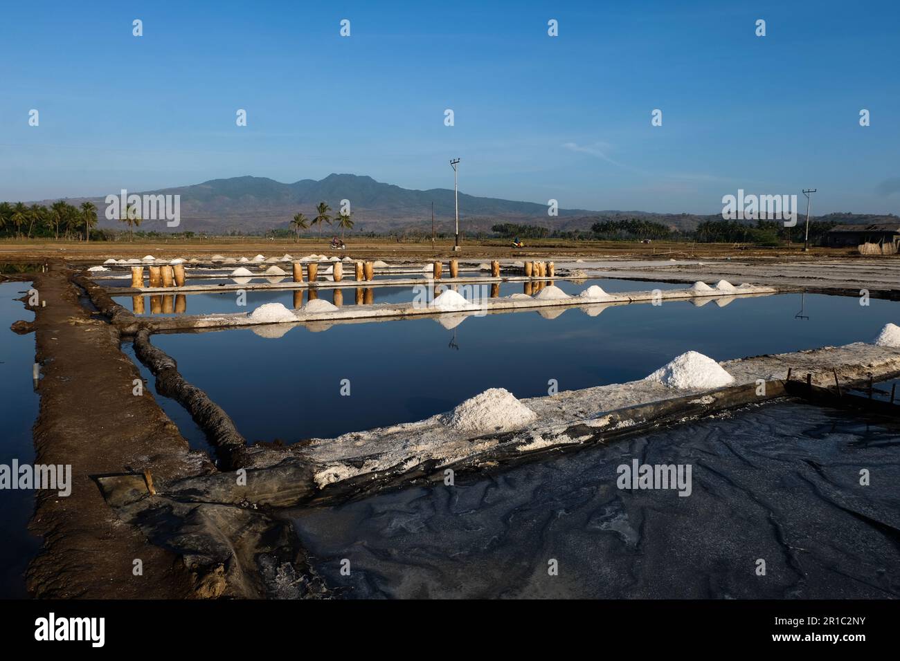 The process of crystallization of sea water into salt in the ...