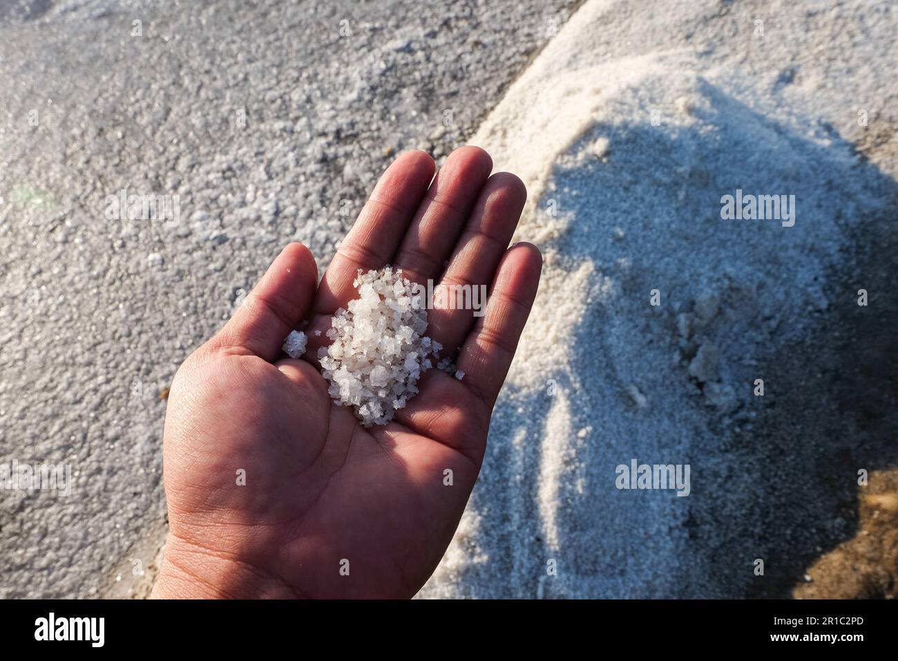 The process of crystallization of sea water into salt in the ...