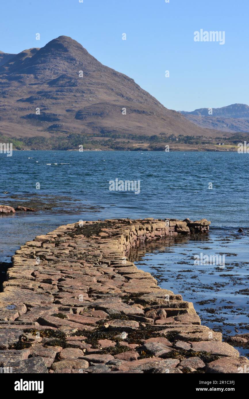 The quay at Inveralligin on Loch Torridon, looking across to Ben Damph ...