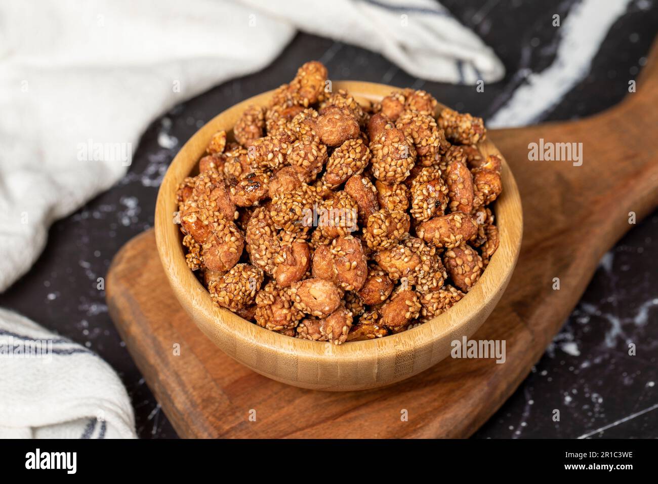 Peanuts with caramel and sesame hi-res stock photography and images - Alamy