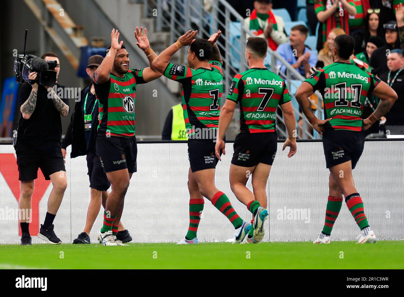 Taane Milne of the Rabbitohs celebrates a try with team mates during ...