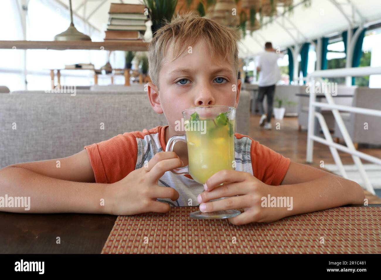 Boy tasting cool lemonade in a restaurant Stock Photo - Alamy