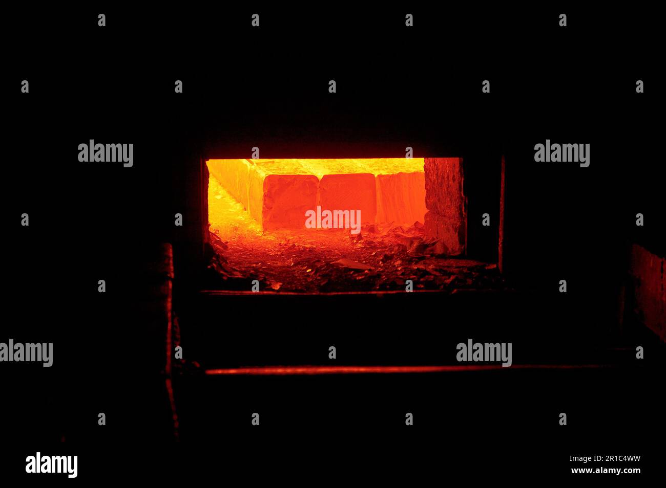 The iron billet is heated in a high-temperature furnace to prepare the ...