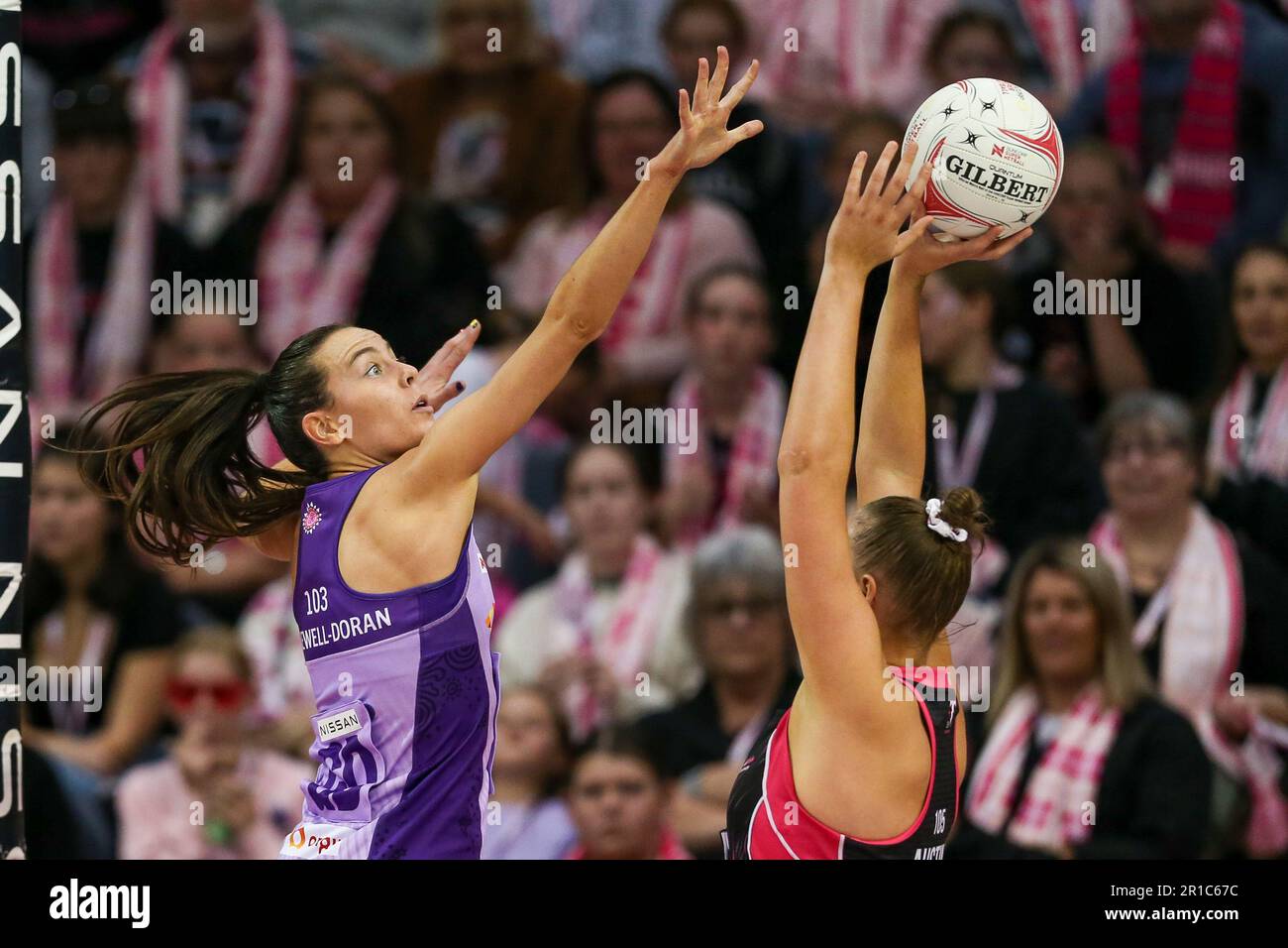 Ruby Bakewell-Doran of the Firebirds defends Lucy Austin of the ...
