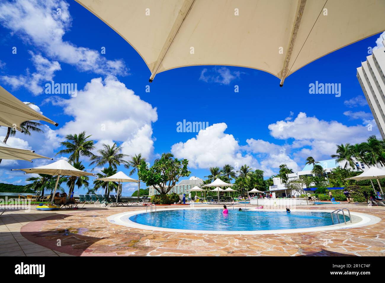 Swimming pool scenery at a hotel in Guam Stock Photo - Alamy