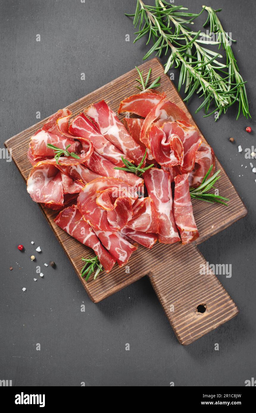 Cured Meat Platter, Antipasto, Appetizer on a Boardover Dark Background ...