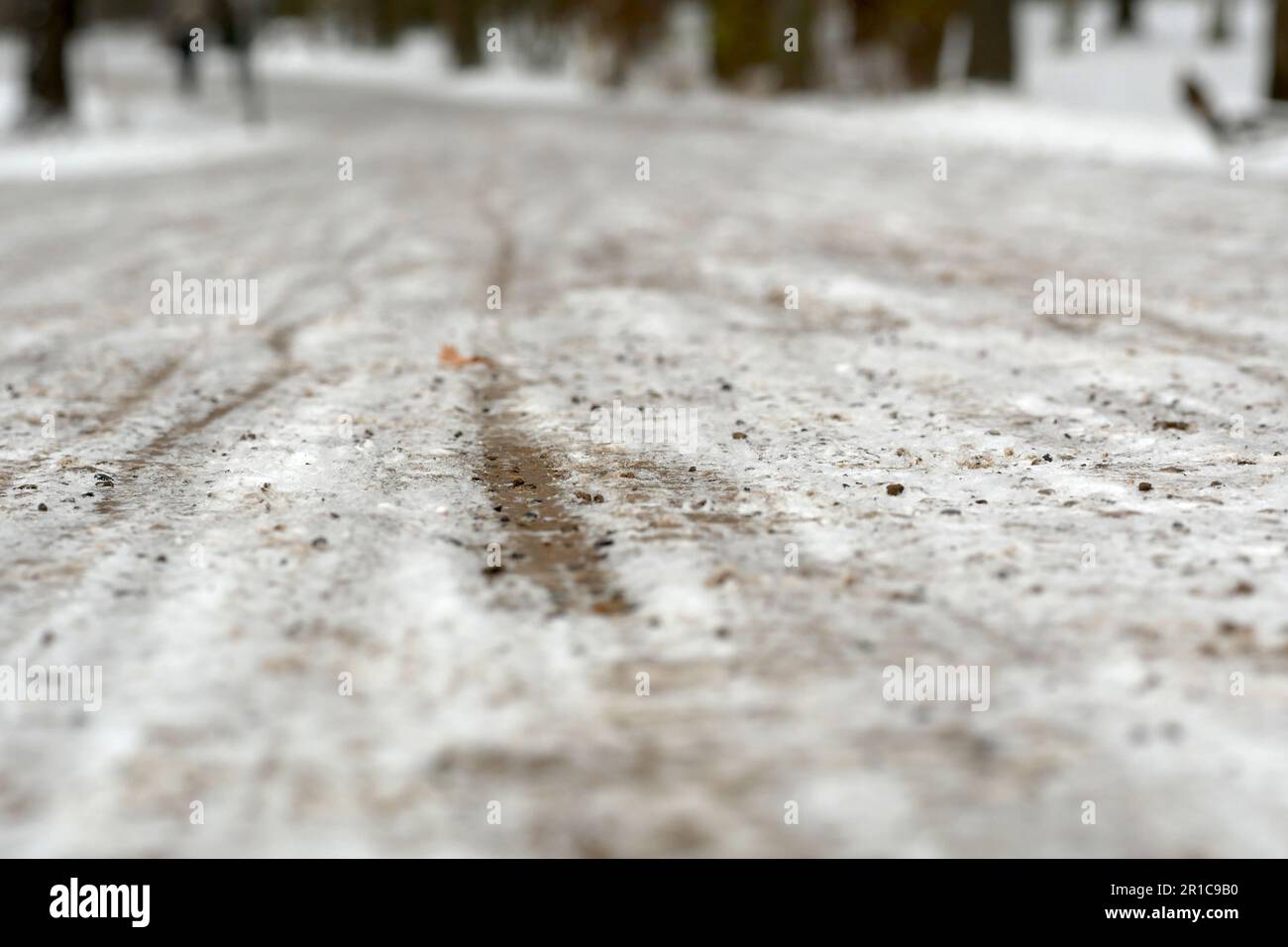 close up of a path in a park covered with snow and gravel Stock Photo ...