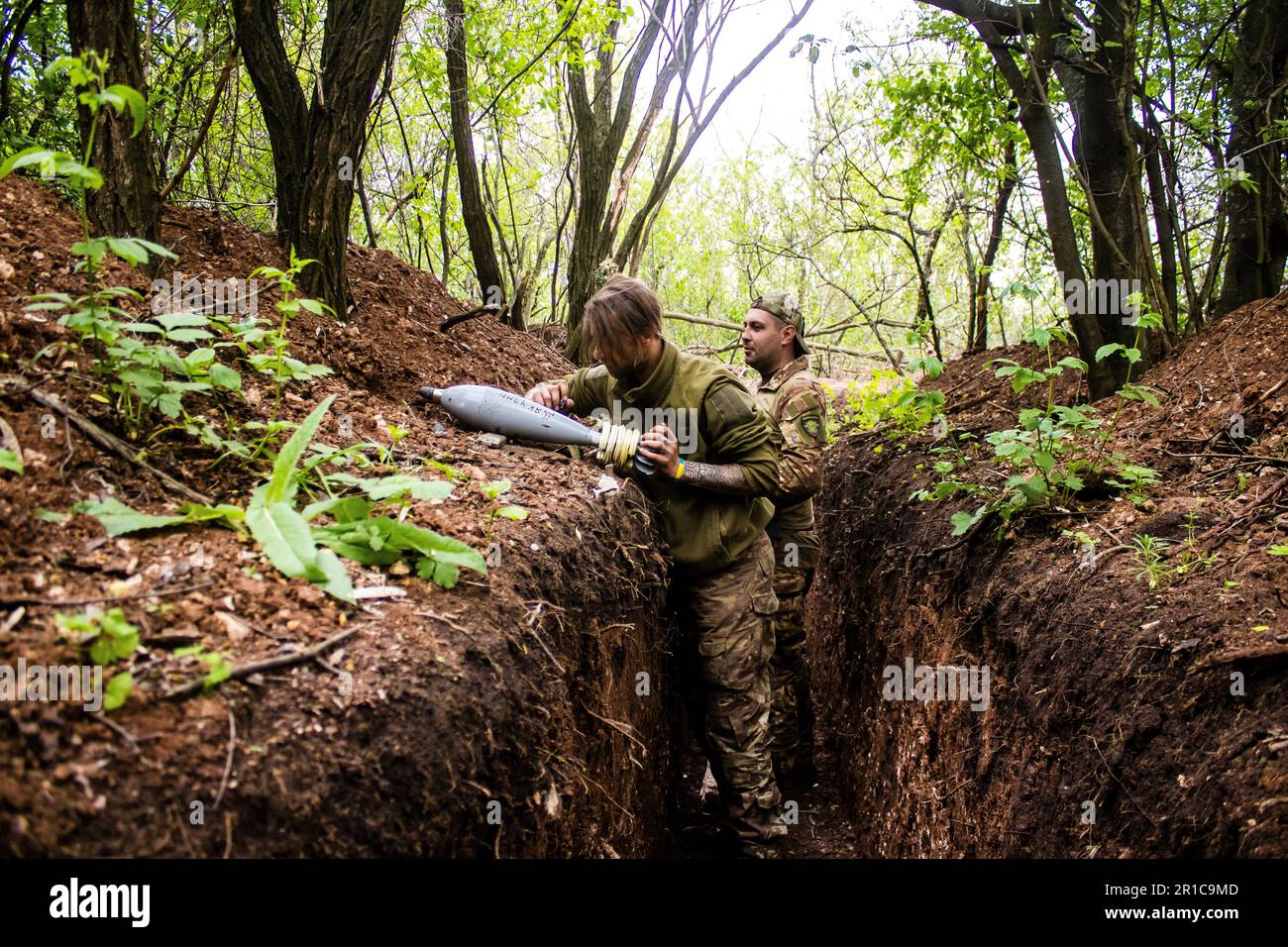 Ukrainian soldier from the 28th Artillery Battalion writing a message ...