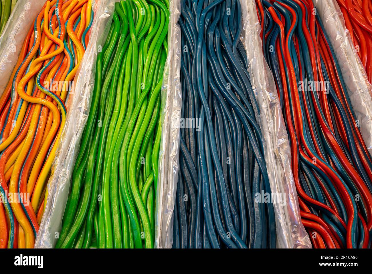 Long, colorful gummy candies for sale on a christmas market in Budapest ...