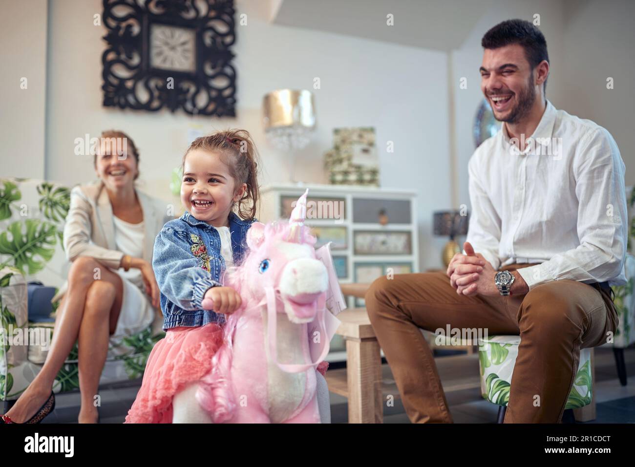 Happy family is captured in a moment of pure joy and happiness. The ...