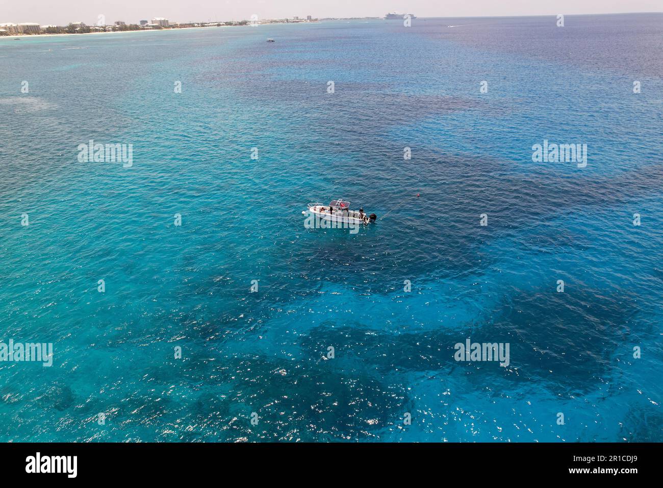 A small boat belonging to the 'Just Dive' company is seen sailing in ...