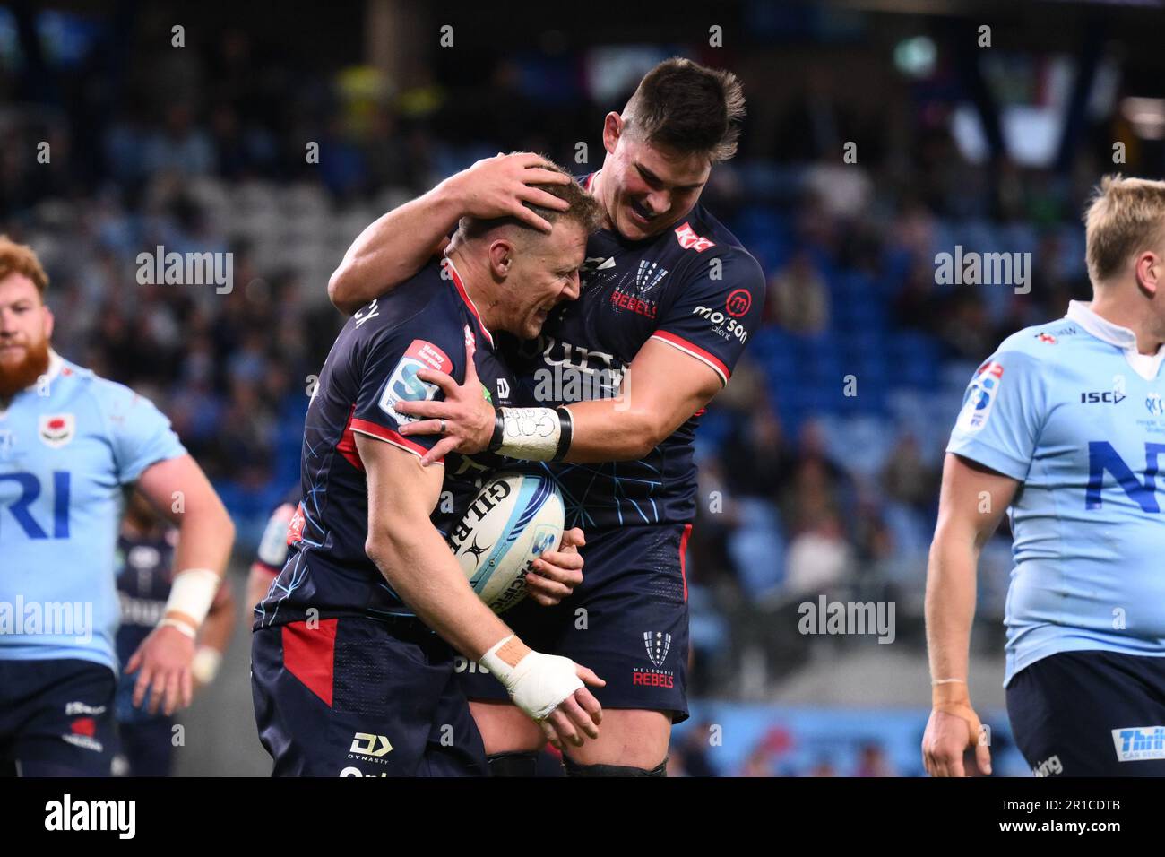 Reece Hodge celebrates scoring a try with Richard Hardwick of the ...