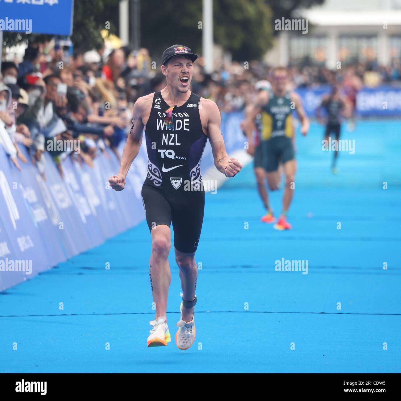 Hayden Wilde of New Zealand, winner, crosses the finish line during ...