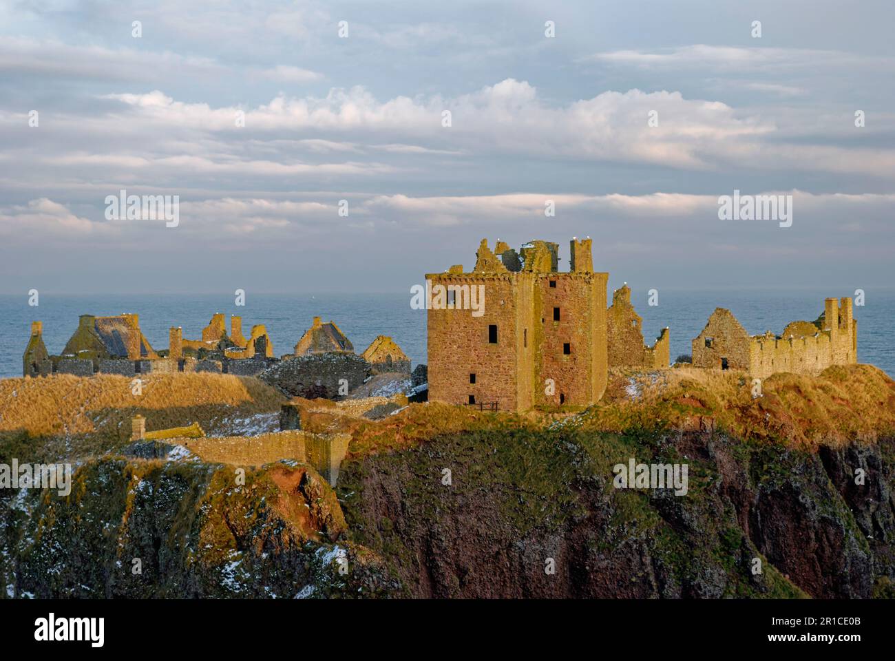 Snow seen on the cliffs on which Dunnottar Castle lies, lit up in the ...