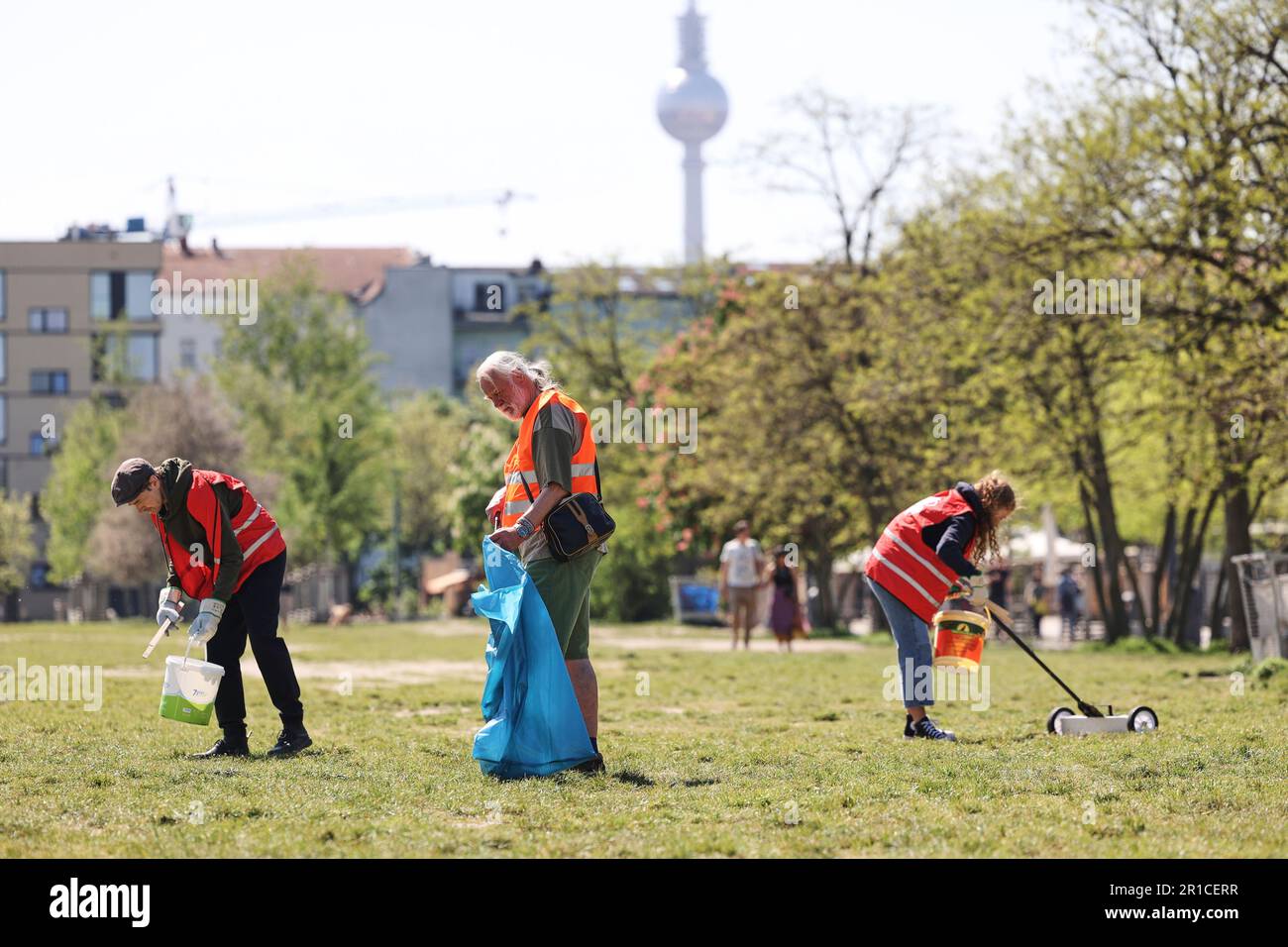 Berlin, Germany. 13th May, 2023. Volunteers collect trash at a waste ...