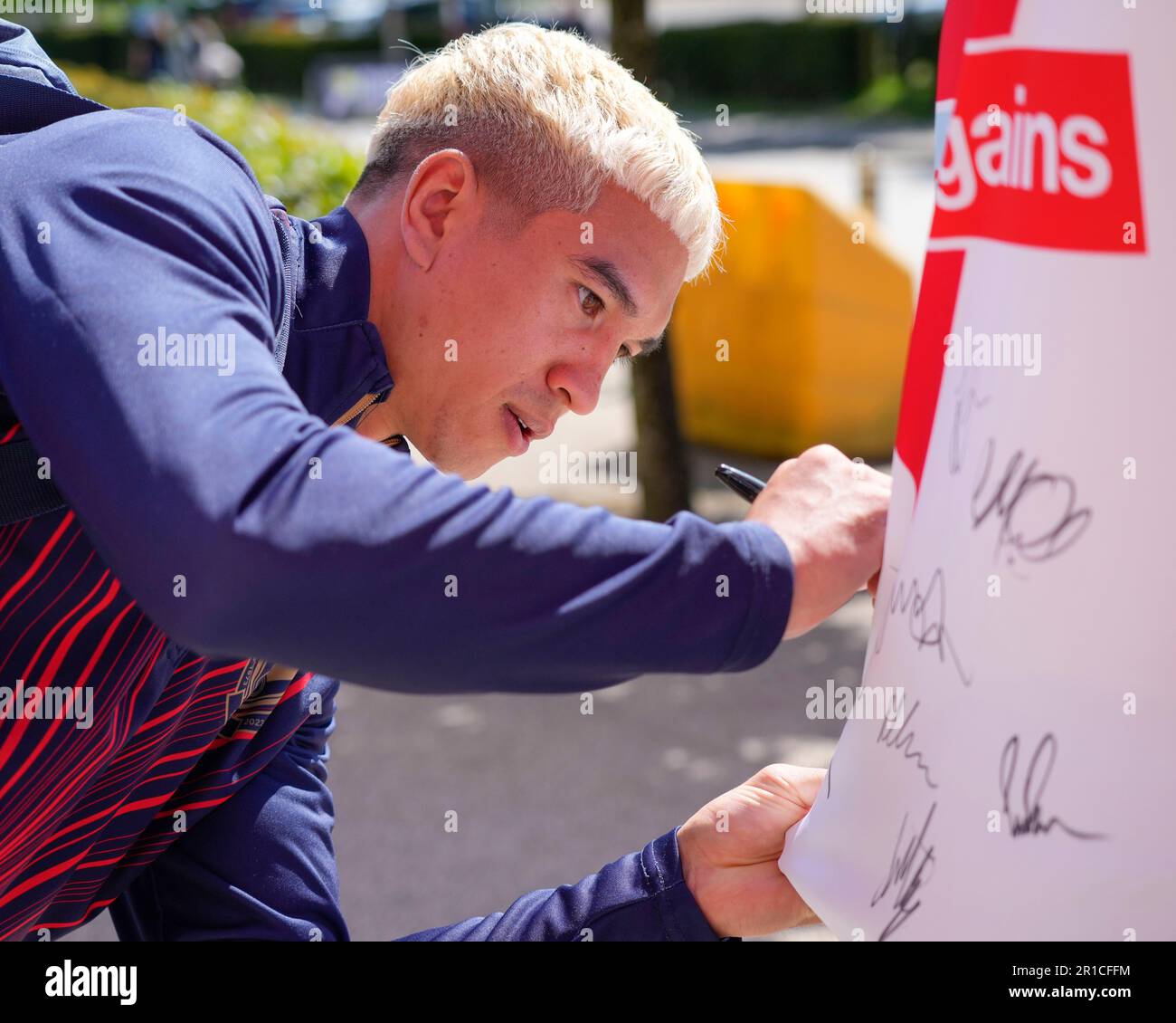 Tee Ritson #25 of St. Helens signs an autograph for a fan before the ...