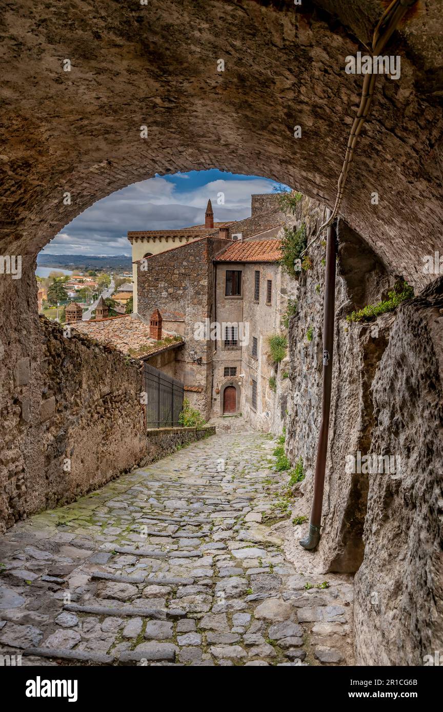 A beautiful covered walkway in the historic center of Bolsena, Italy ...