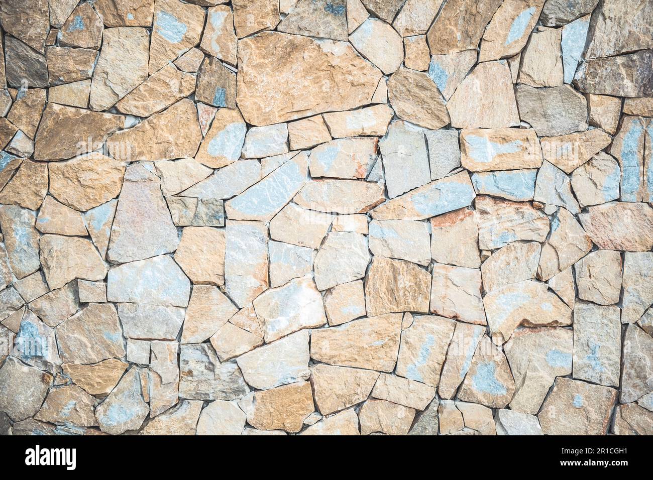 Masonry wall of natural brown stones with irregular pattern texture ...