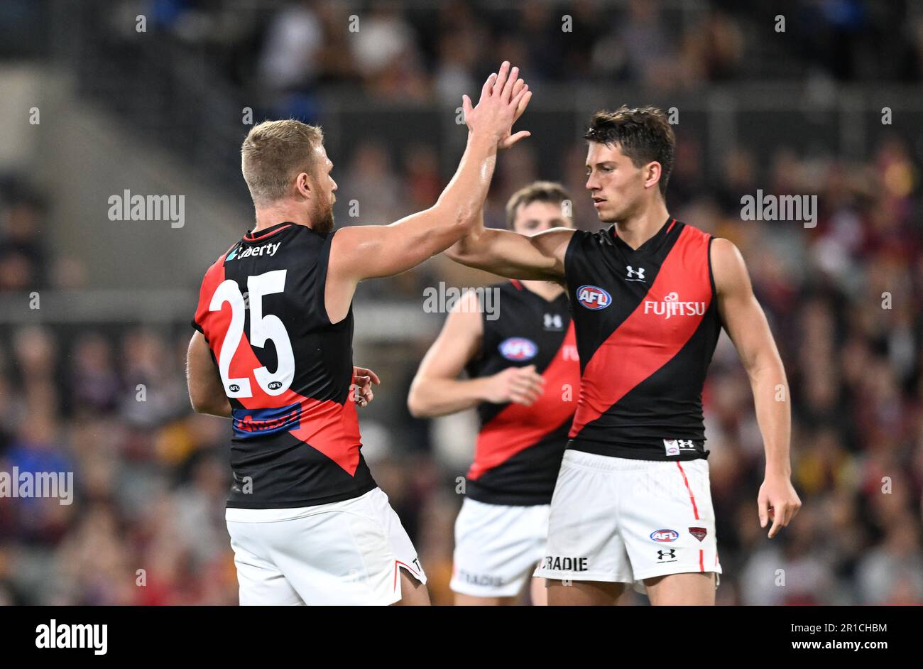 Jake Stringer (left) of the Bombers celebrates kicking a goal Archie ...