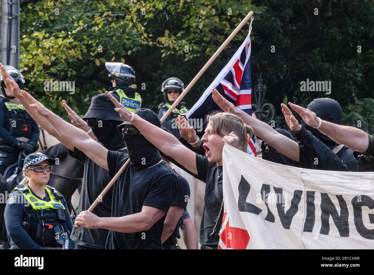 Neo-Nazis protesters with flags salute as they are ordered to leave the ...