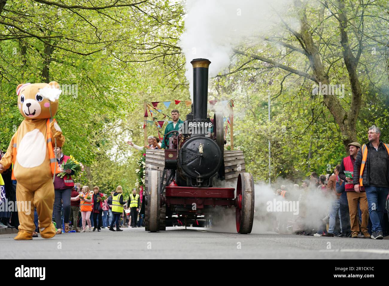 A steam traction engine leads the Spalding Flower Parade as it makes ...