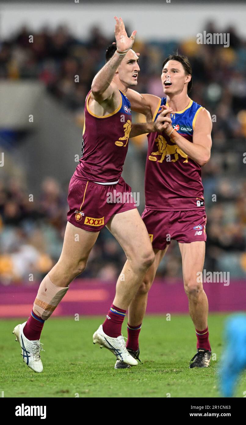 Oscar McInerney (left) of the Lions celebrates kicking a goal with Eric ...