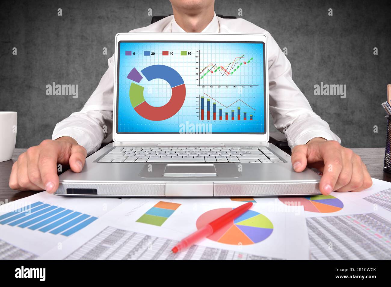 Businessman and laptop with stock chart on screen Stock Photo - Alamy