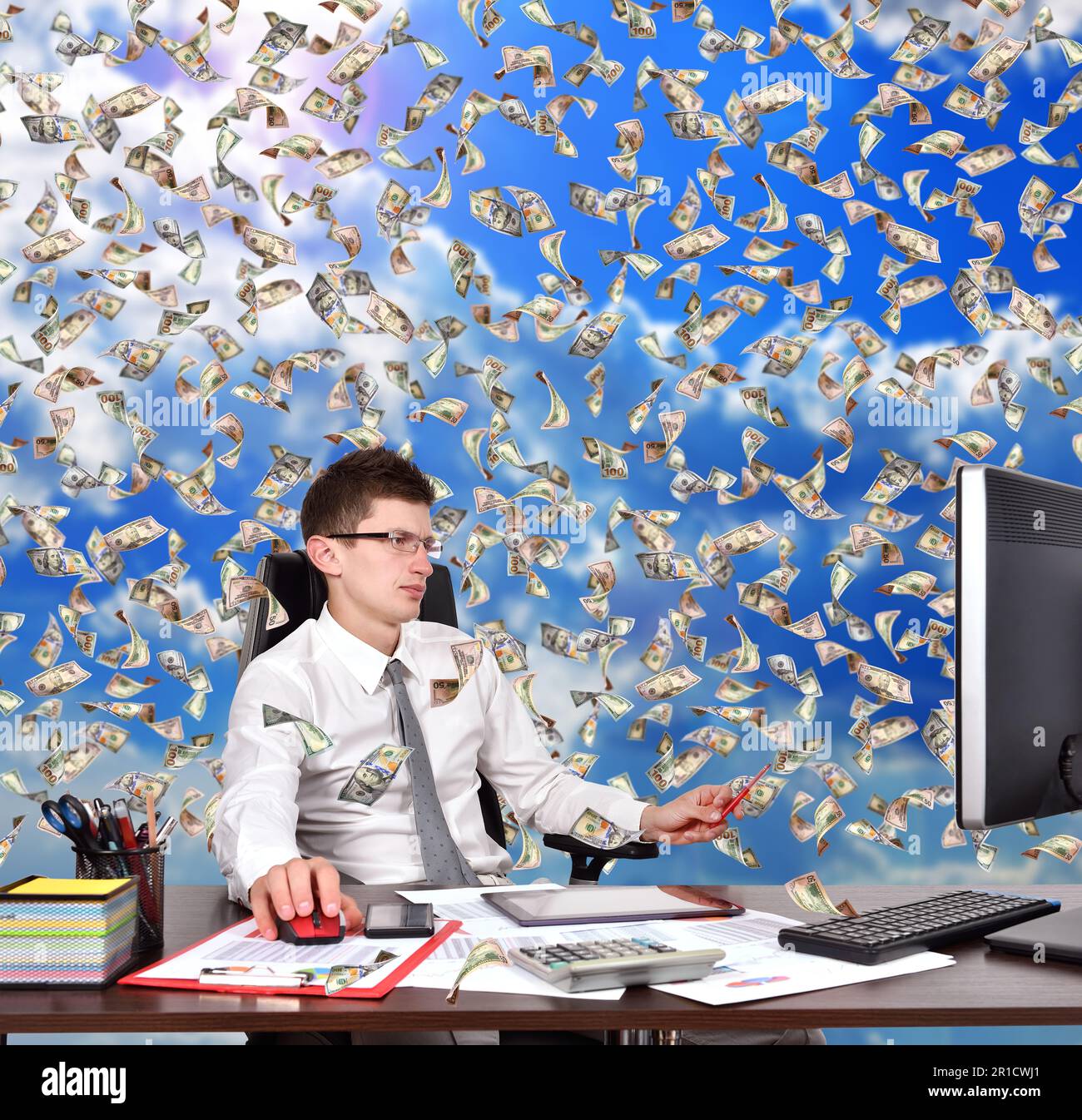 businessman sitting in office and falling dollars banknote on sky ...