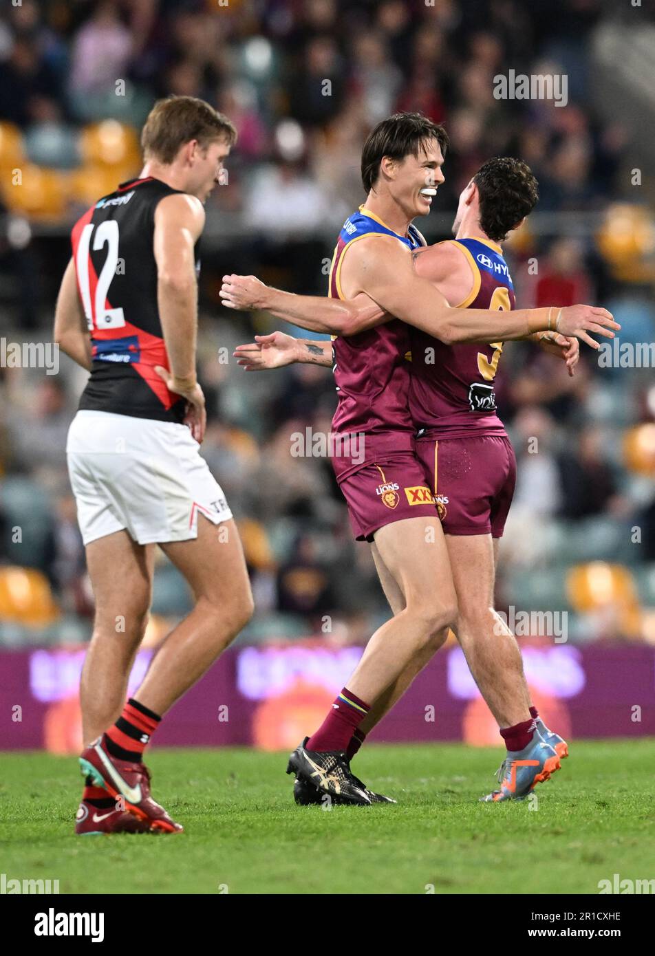 Eric Hipwood (centre) of the Lions celebrates kicking a goal with ...