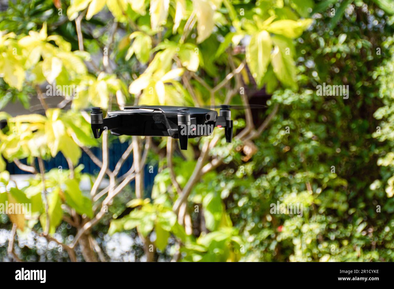 Unmanned black drone hover land hi-res stock photography and images - Alamy