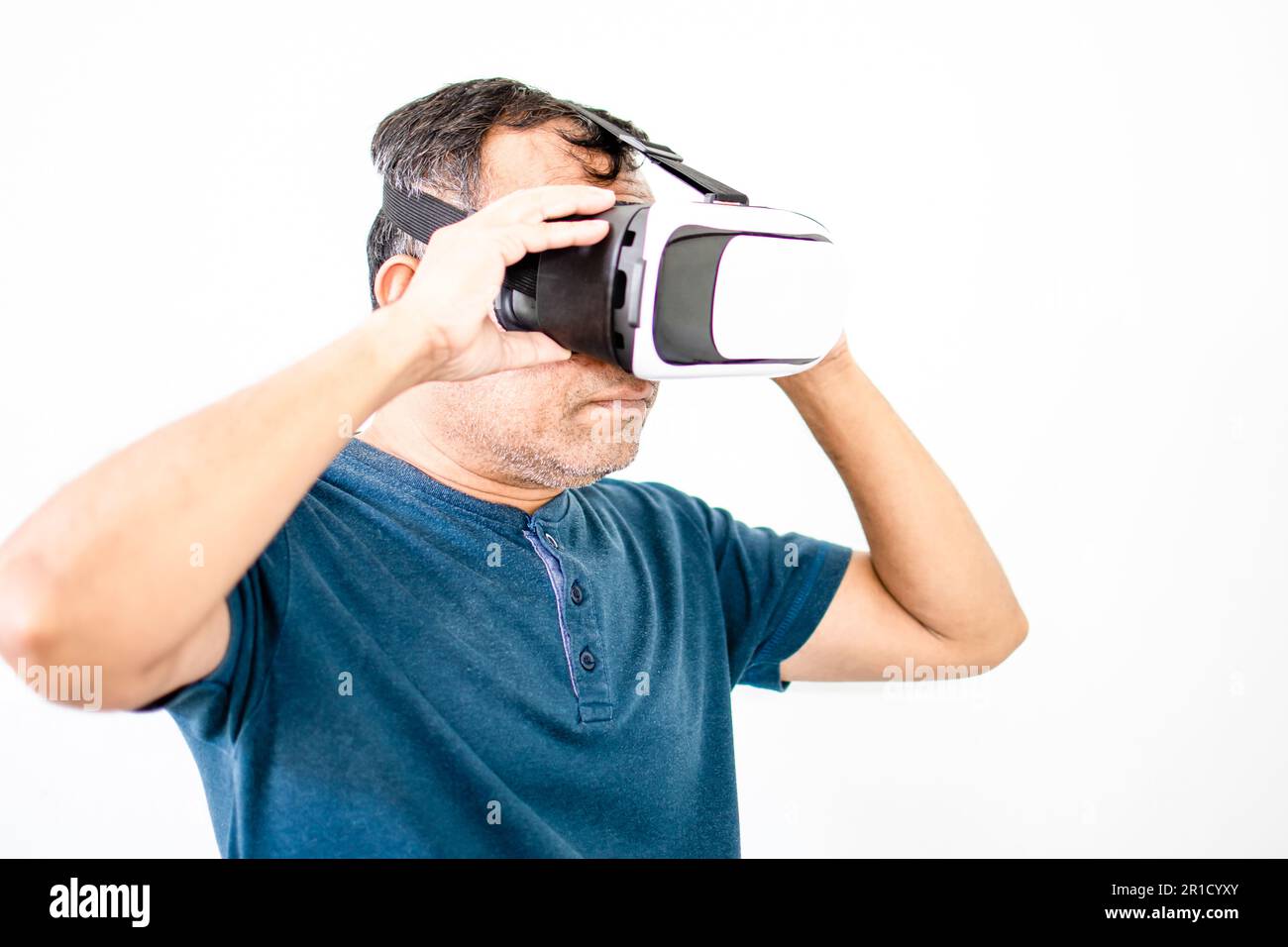 Alone man Standing tilt and with both hands holding Virtual reality ...