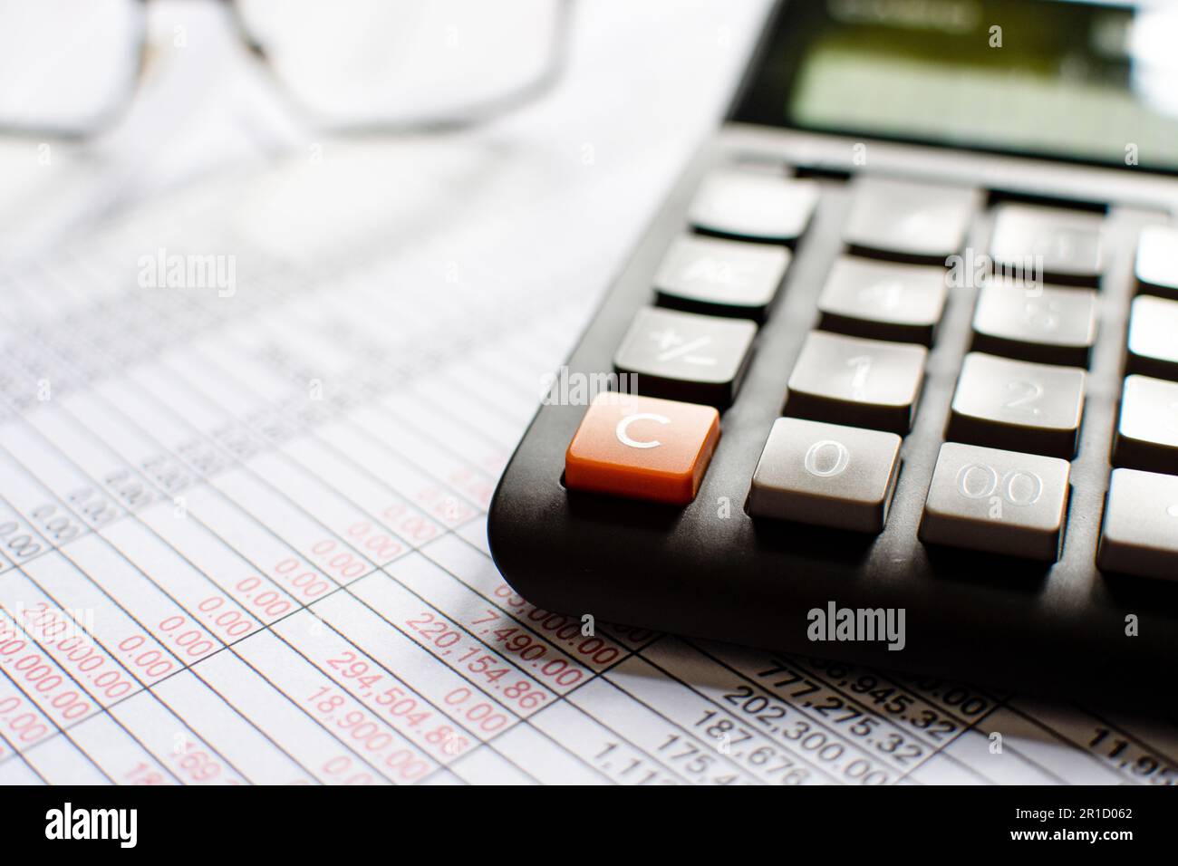 Financial accounting, Close-up numbers on paper and calculator, Many ...