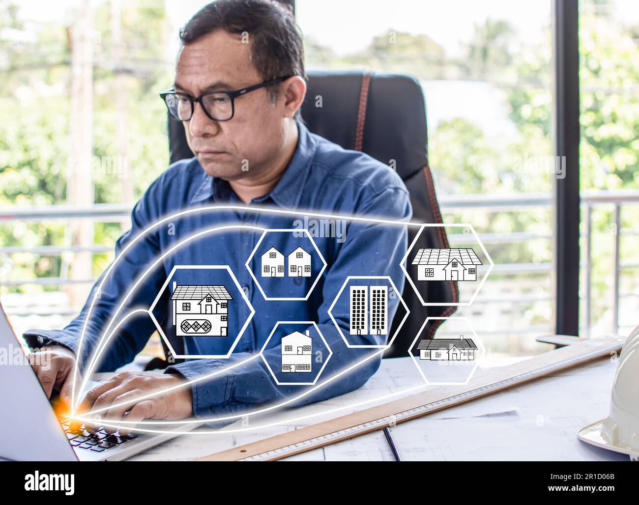 Man architect using a laptop Computers to design and calculate the ...