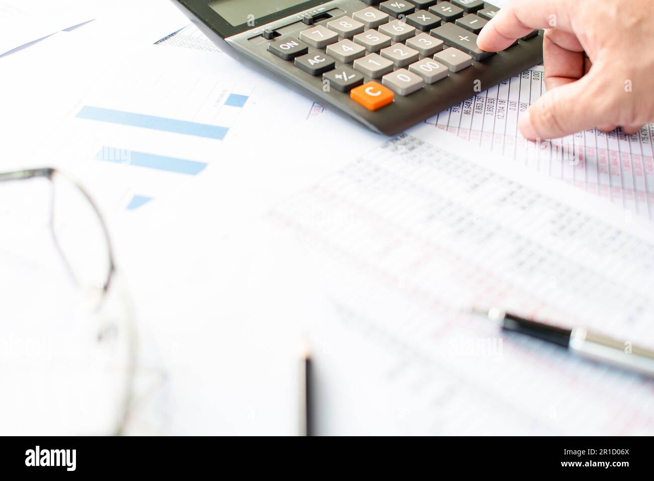 Financial accounting, Closeup, Man's finger pressing a calculator ...
