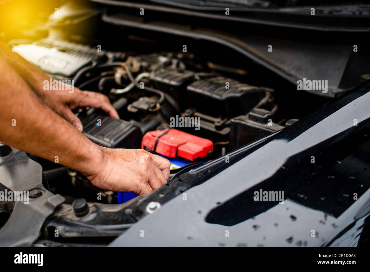 Closeup, The hands of a male technician are using a tool to replace the ...