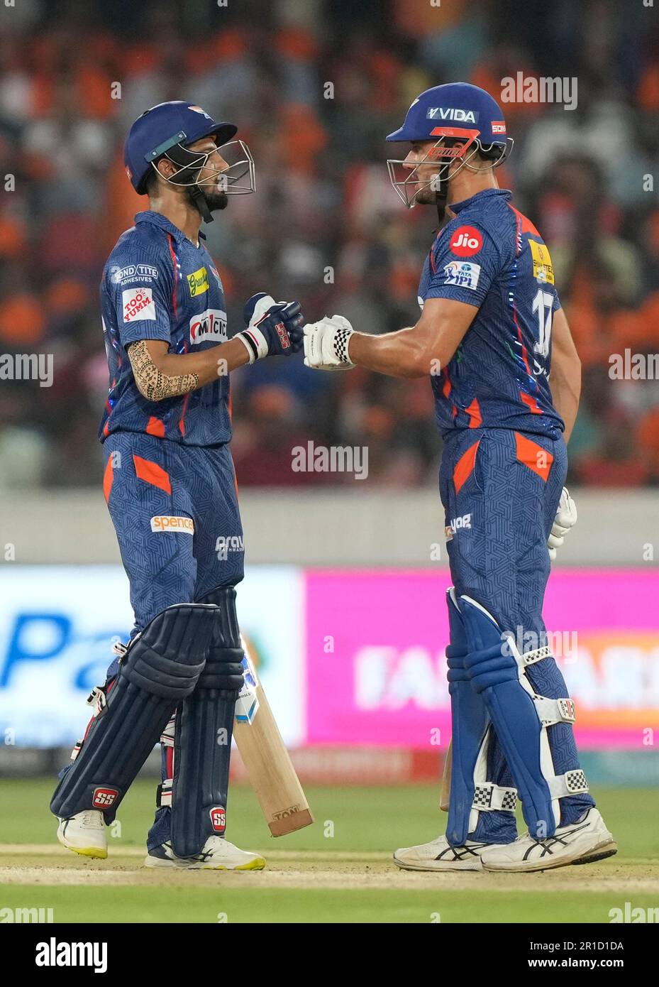 Lucknow Super Giants' Marcus Stoinis, right, congratulates teammate ...