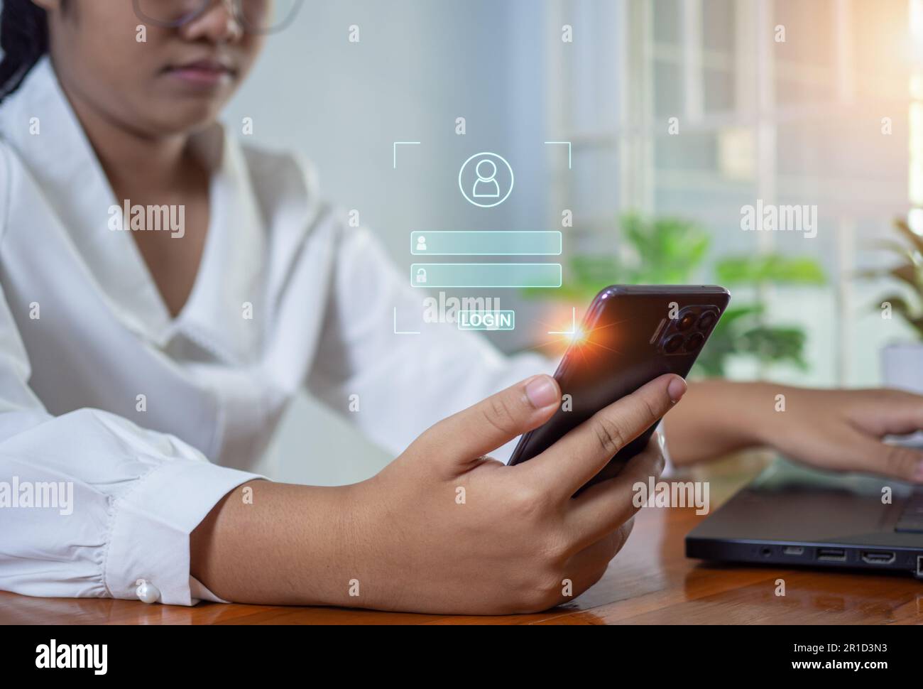 Human looking at phone screen with login screen. Represents code ...