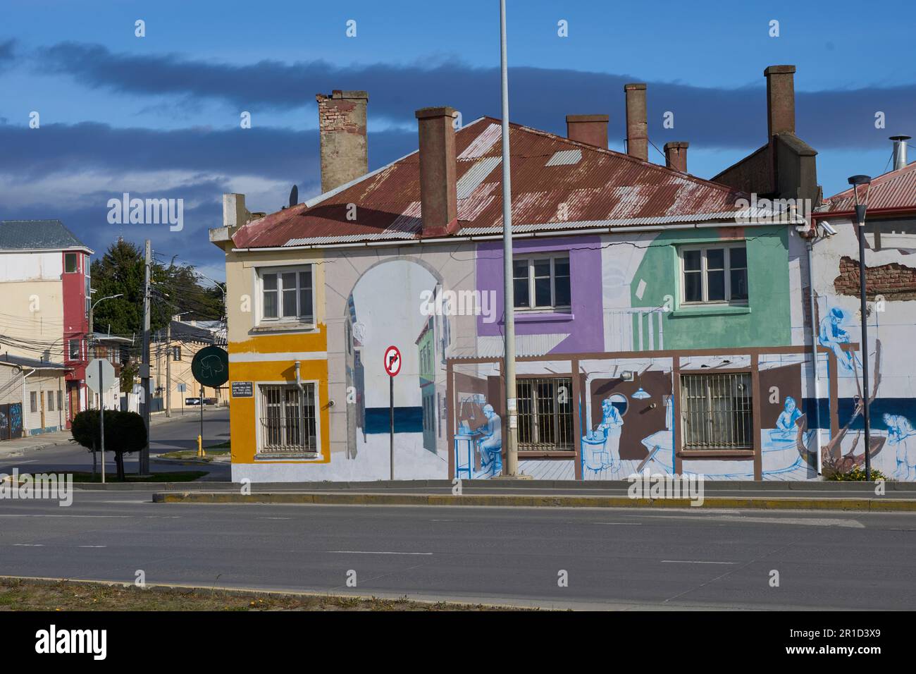 Historic buildings decorated with murals along the waterfront of Punta ...