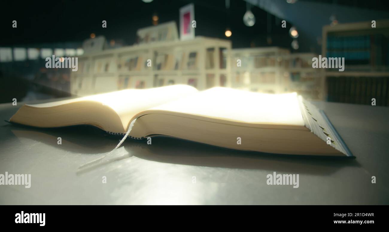 Glowing pages of an open book close-up. Reading knowledge concept ...
