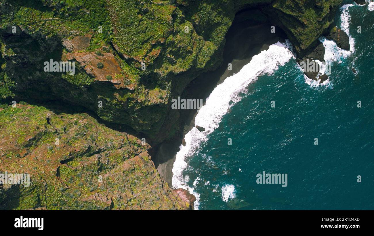 Rocky ocean coastline landscape. Aerial top down view of Anaga green ...