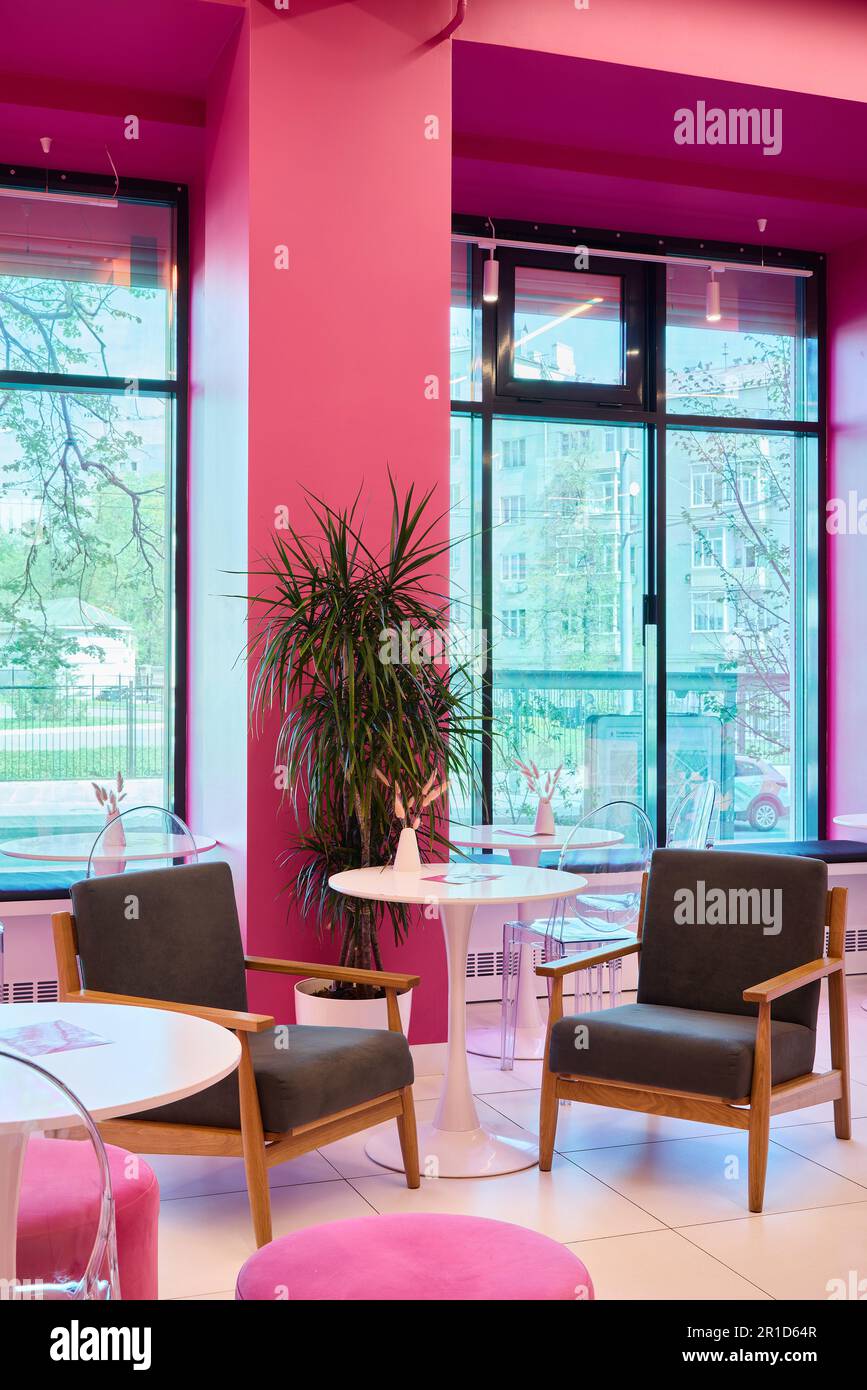 Modern pink interior with lots of plants Stock Photo - Alamy