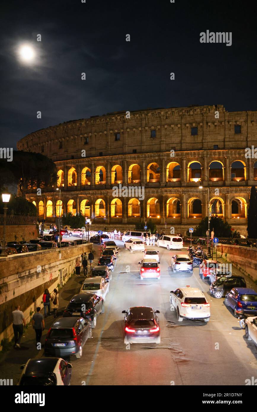 An urban street scene illuminated by a multitude of colorful street ...
