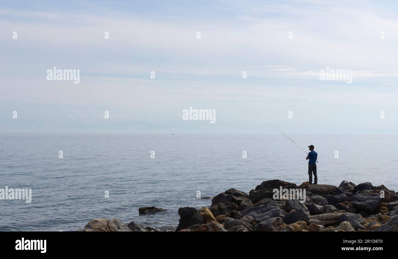 Man casts fishing line in hi-res stock photography and images - Alamy